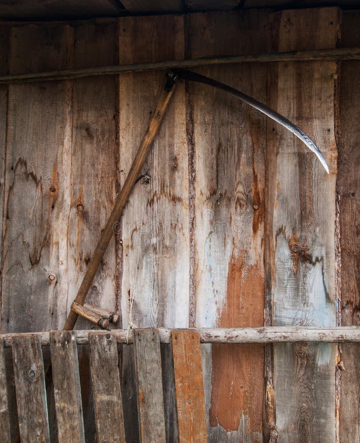 Old Scythe Hanging on a Wooden Roof. Agriculture Concept. Stock Image ...