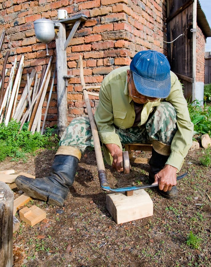 Scythe whetting stock image. Image of full, rectify, stick - 19129753