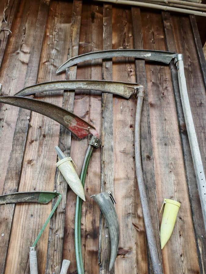 Scythes Hanging in Front of Farm House Stock Image - Image of grassland ...