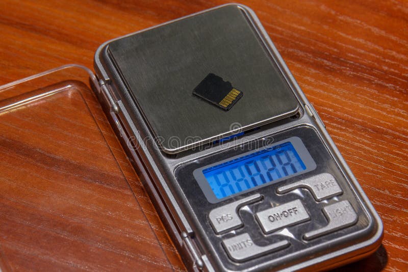 Sd card on digital scales stock photo. Image of measure - 87080094