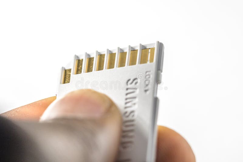 SD card on finger tip editorial stock photo. Image of white - 108780813