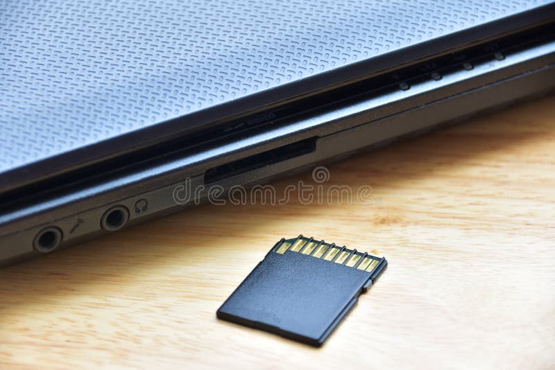 Sd Card in Slot with Computer Notebook. Stock Photo - Image of ...