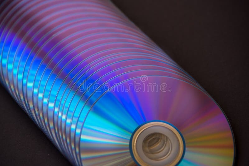 Sd and Dvd Disks on a Dark Background. Large Stack. Stock Photo - Image ...