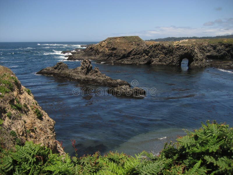Sea arch stock photo. Image of hike, seas, flower, clouds - 3457064