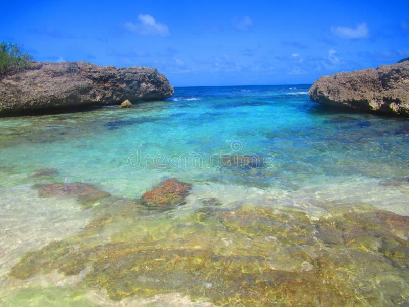 The Sea in a Bay Surrounded by Rocks Stock Image - Image of rock, blue ...