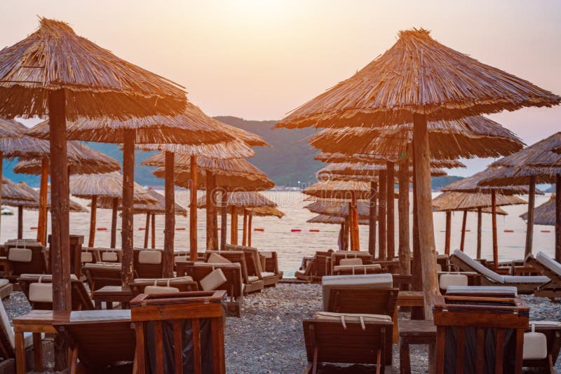 Sea Beach with Straw Umbrellas and a Number of Beach Beds Stock Photo ...