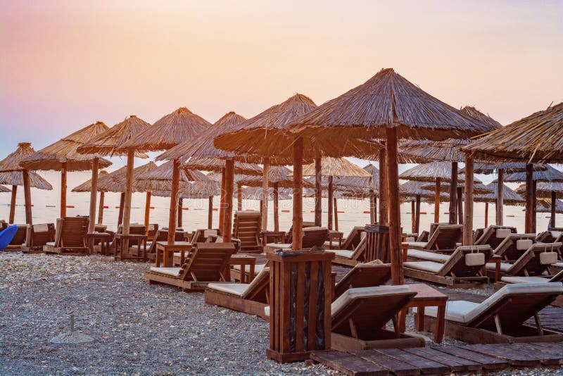 Sea Beach with Straw Umbrellas and a Number of Beach Beds Stock Image ...