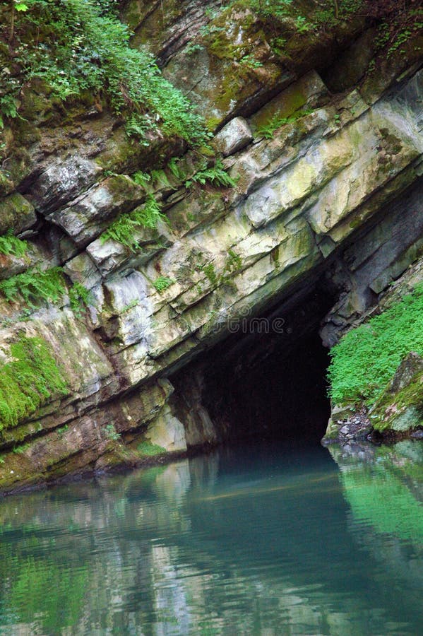 Cave entrance with stream stock image. Image of rocky - 3265917