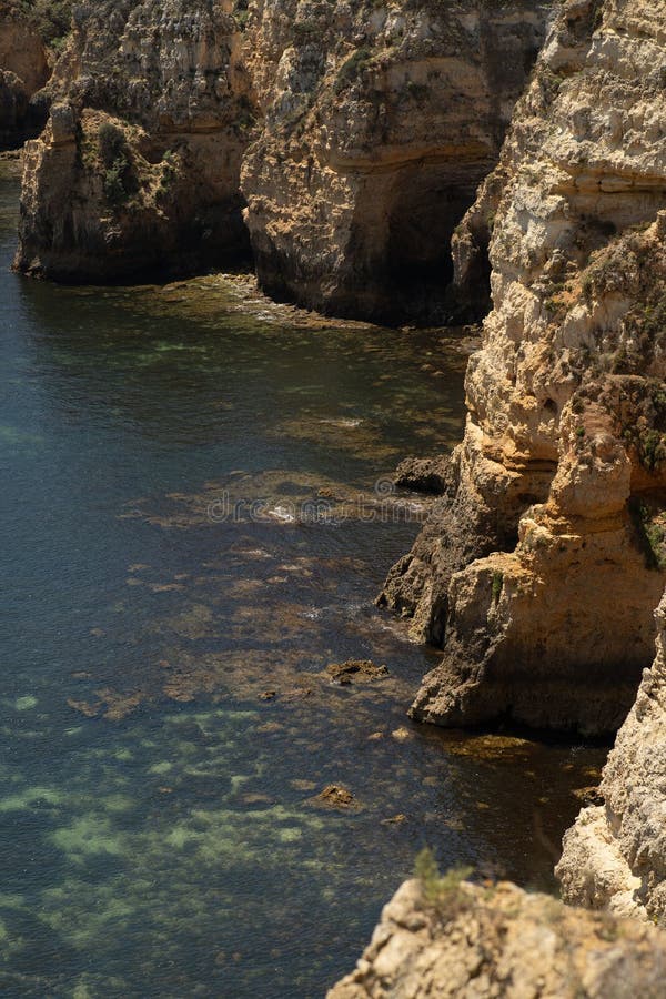 Sea Cave Surrounded by Rocky Walls in Algarve Stock Image - Image of ...