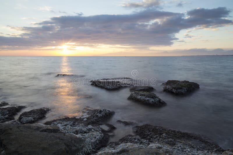 Sea Coast in a Long Exposure Shot at Sunset, with Blurred Water Stock ... Sea Coast in a Long Exposure Shot at Sunset, with Blurred Water Stock ...