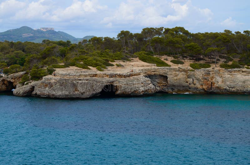 Sea Cove with a Small Sea Cave Stock Photo - Image of balearic, water ...