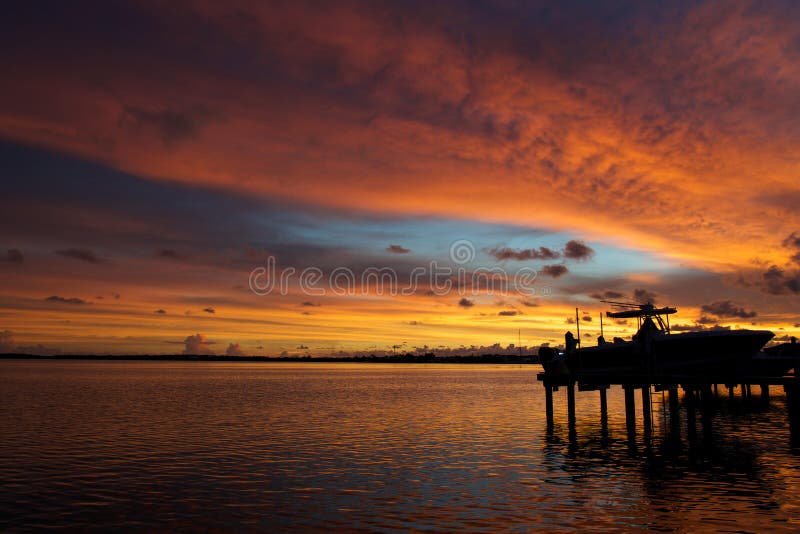 Sea dock at sunset stock photo. Image of color, colors - 83062874
