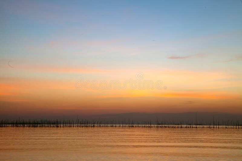 The Sea in the Evening with Poles Planted Stock Image - Image of bamboo ...