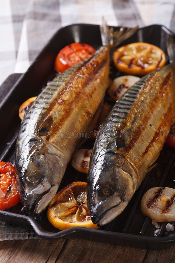 Sea fish grilled mackerel and vegetables closeup. Vertical - Stock ...