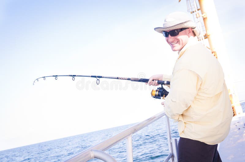 Man Fishing for Cods at Sea Stock Image - Image of blue, fish: 6152057