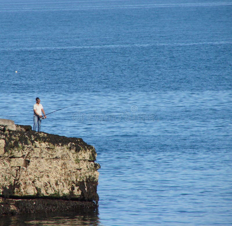 Sea fishing on rocks stock image. Image of fishing, salt - 3408803
