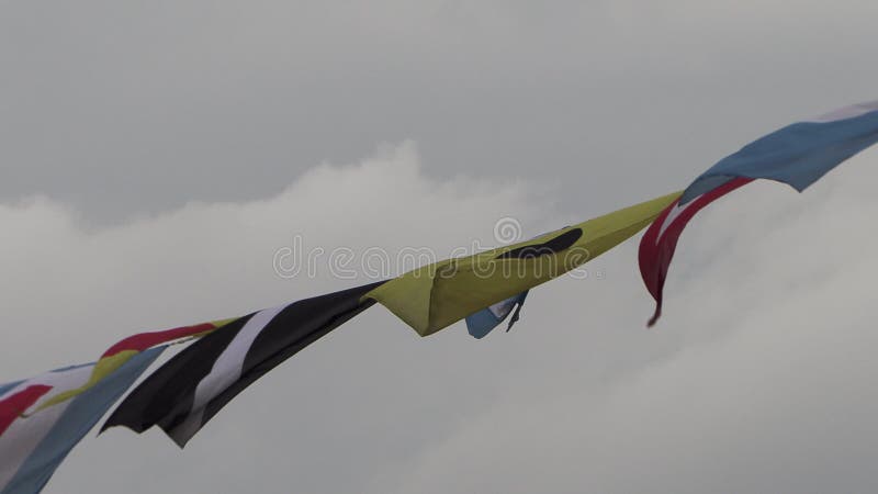 Sea Flags of the International Code of Signals Fluttering in the Wind ...