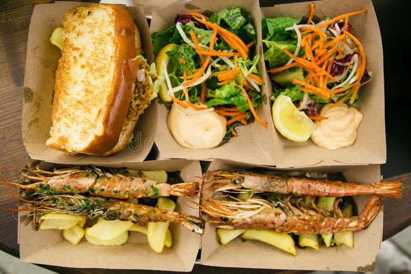 Sea Food in Paper Boxes on the Table Stock Image - Image of octopus ...