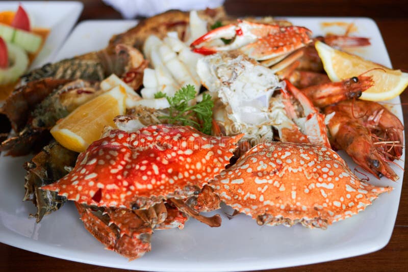 Sea Food on Plate Include Shrimps ,lemon,squid and Crab Shell Stock ...