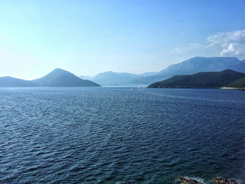 Sea and hills stock image. Image of deep, clear, hills - 78433301