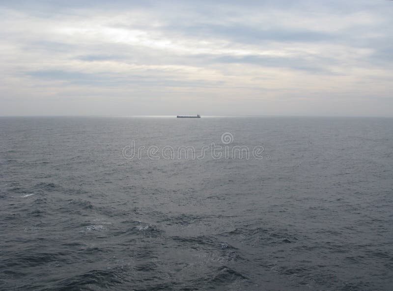 Sea and Horizon with Container Ship in Distance a Stock Image - Image ...