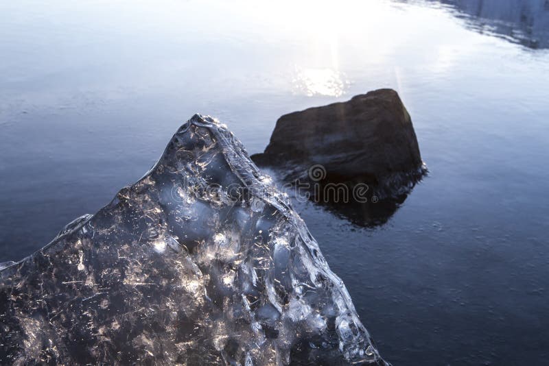 Sea ice with incoming tide stock image. Image of beach - 84753545