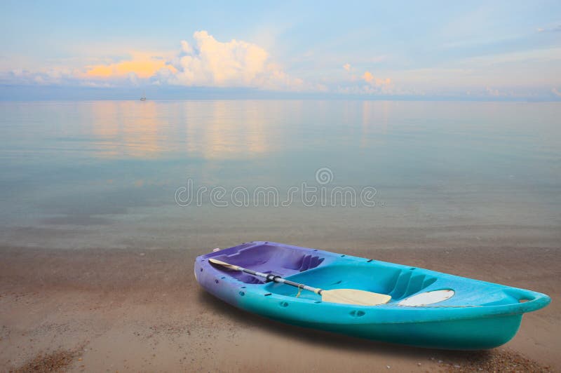 Sea kayak on sand beach stock photo. Image of kayak, pupple - 24363044