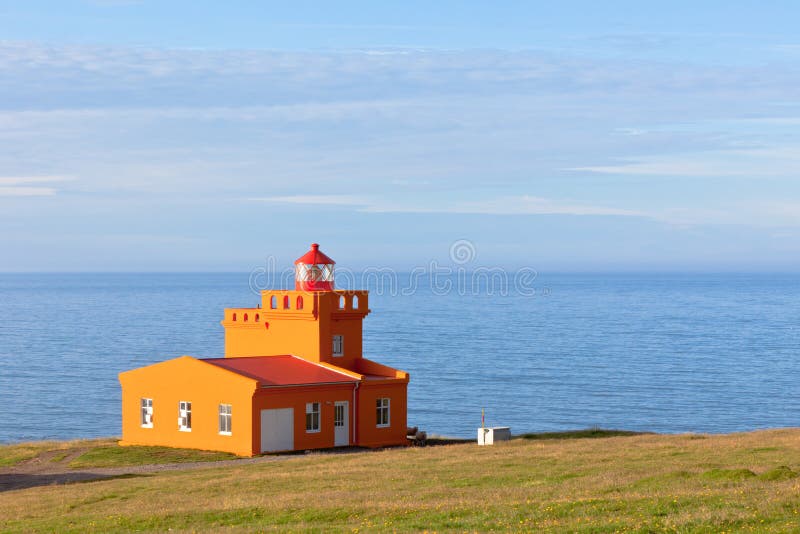 Sea Landscape with Orange Lighthouse and Blue Sky Stock Photo - Image ...