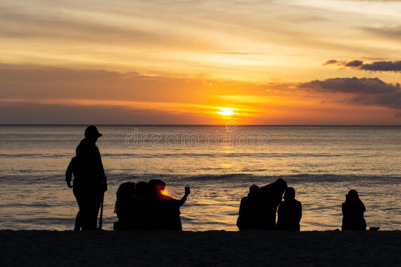 Sea Landscape at Sunset. Group of People Enjoying Sunset View at the ...