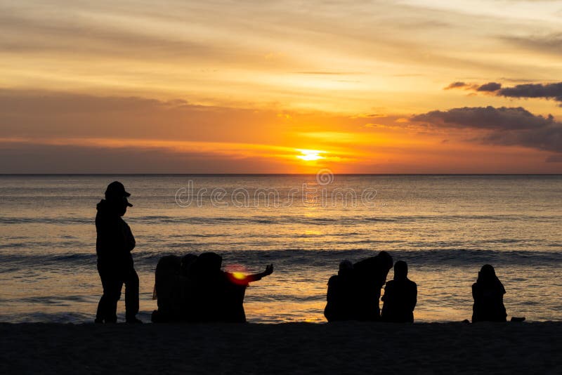 Sea Landscape at Sunset. Group of People Enjoying Sunset View at the ...
