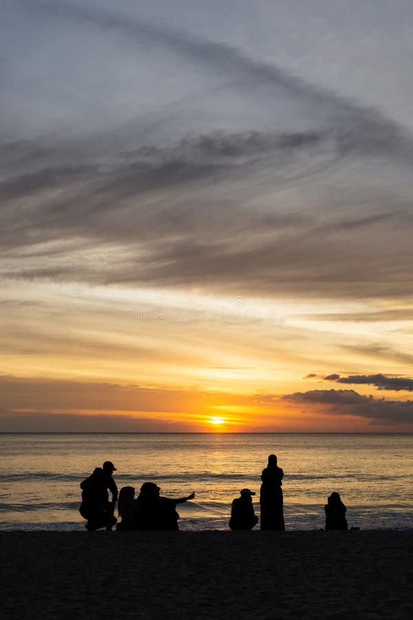 Sea Landscape at Sunset. Group of People Enjoying Sunset View at the ...