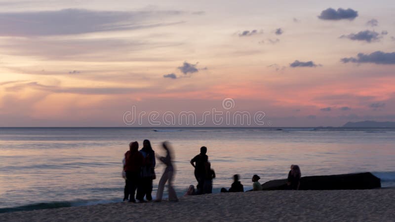 Sea Landscape at Sunset. Group of People Enjoying Sunset View at the ...