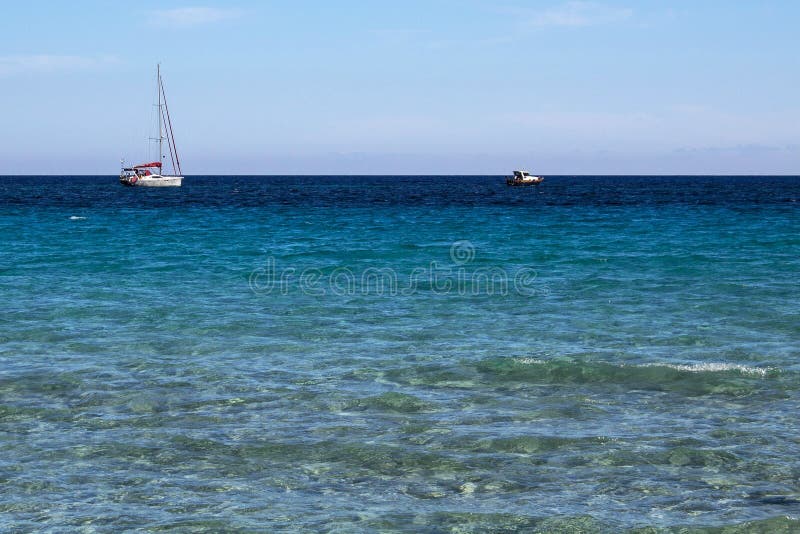 Sea of Many Colors and Boats in the Background Stock Image - Image of ...