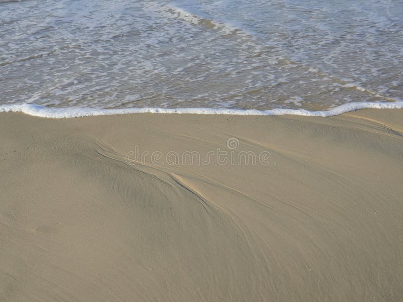Sea Meets Water Patterned Sand on the Shoreline. Stock Image - Image of ...