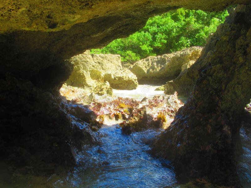 The Sea Passes in a Small Cave Stock Photo - Image of small, paradise ...