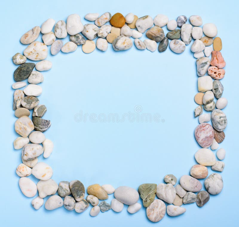 Sea Pebbles Over Light Blue Background, Copy Space Stock Image - Image ...