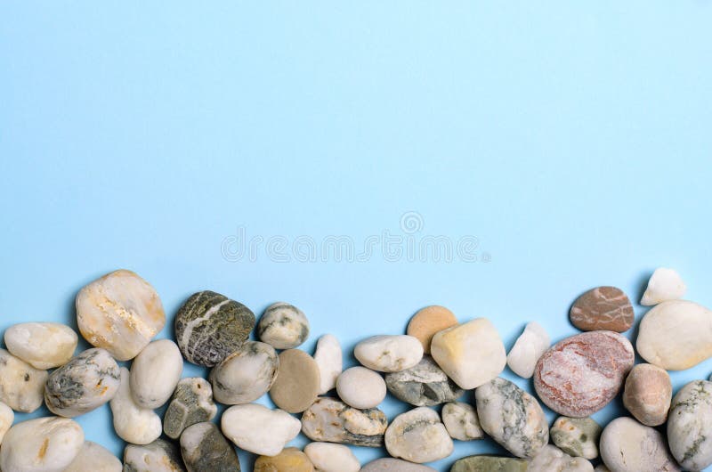 Sea Pebbles Over Light Blue Background, Copy Space Stock Image - Image ...