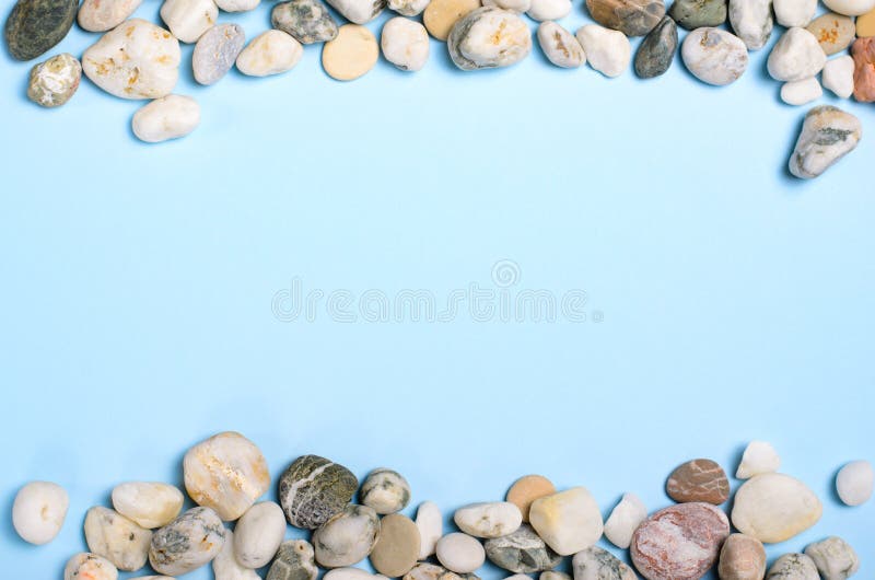 Sea Pebbles Over Light Blue Background, Copy Space Stock Image - Image ...