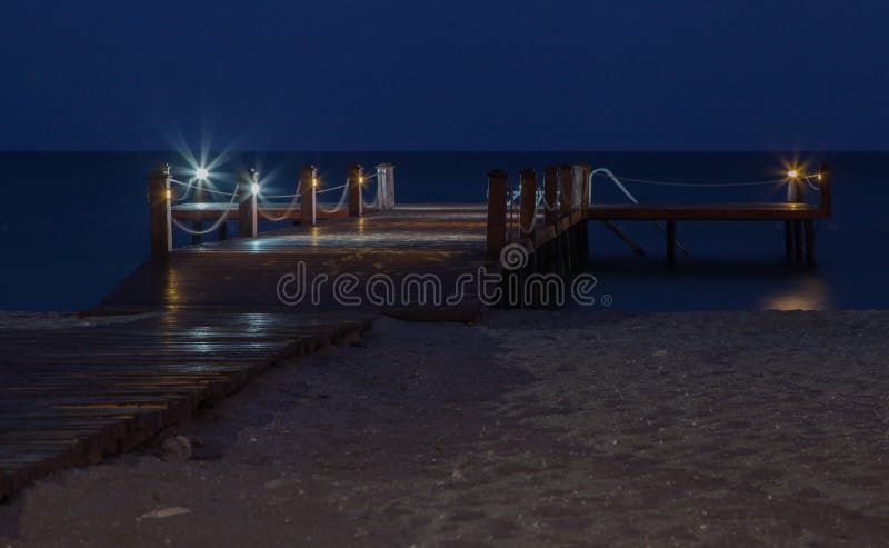 Sea pier at night stock photo. Image of moon, beach, background - 75867442