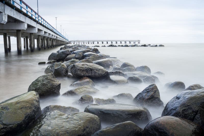 Sea, pier and rocks stock image. Image of coastal, baltic - 35968317