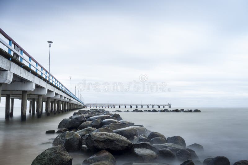 Sea, pier and rocks stock image. Image of rest, beautiful - 35968345