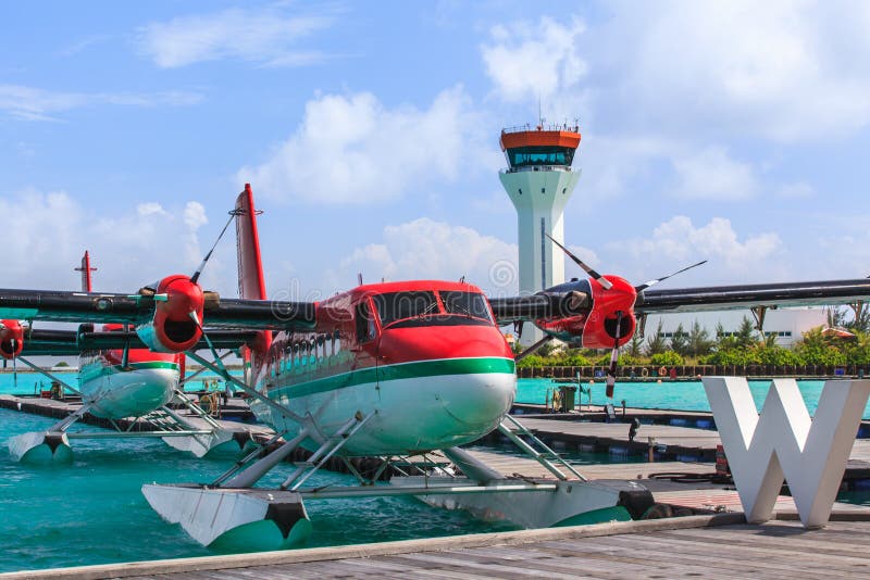 Sea Plane Docked at the Arrival Pier. Maldives Stock Image - Image of ...
