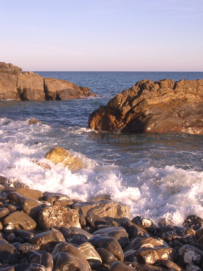 Sea and red rocks stock image. Image of chalk, water, rocks - 3792191