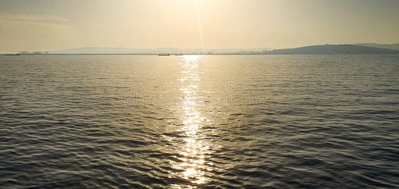 Sea Reflecting the Sun in Sunset Stock Photo - Image of nature, natural ...