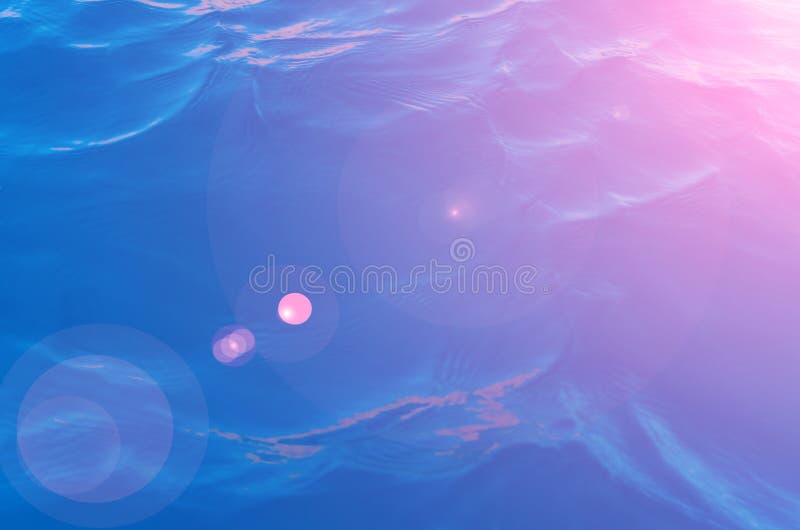Sea ripples and pink glow stock photo. Image of deep - 160442596