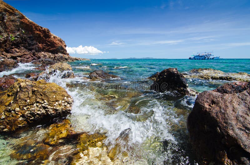 Sea Rock and Ship stock image. Image of wave, rock, beach - 63266967