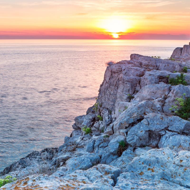 Sea and Rock at the Sunset. Stock Photo - Image of reflection ...