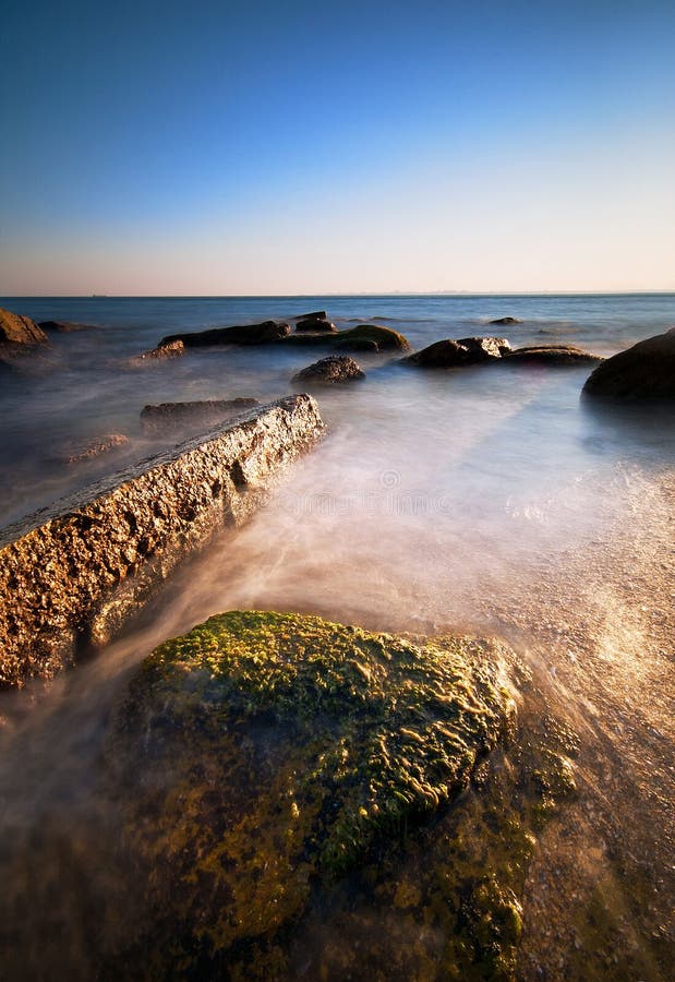 Sea rocks at the sunset stock photo. Image of ocean, light - 21399742