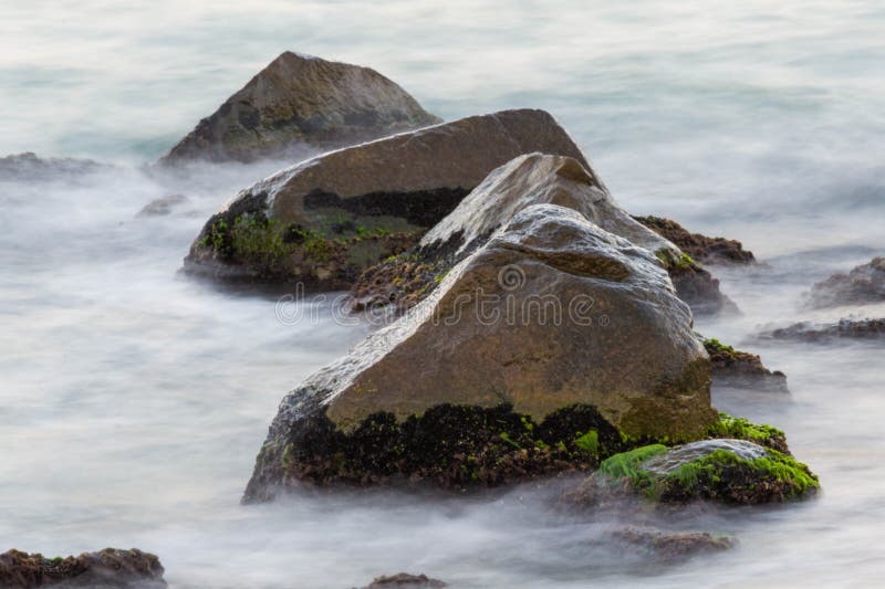 Sea with rocks stock photo. Image of rocks, dusk, scenery - 56894054