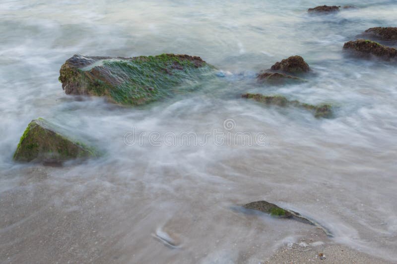 Sea with rocks stock image. Image of moody, speed, twilight - 56894087